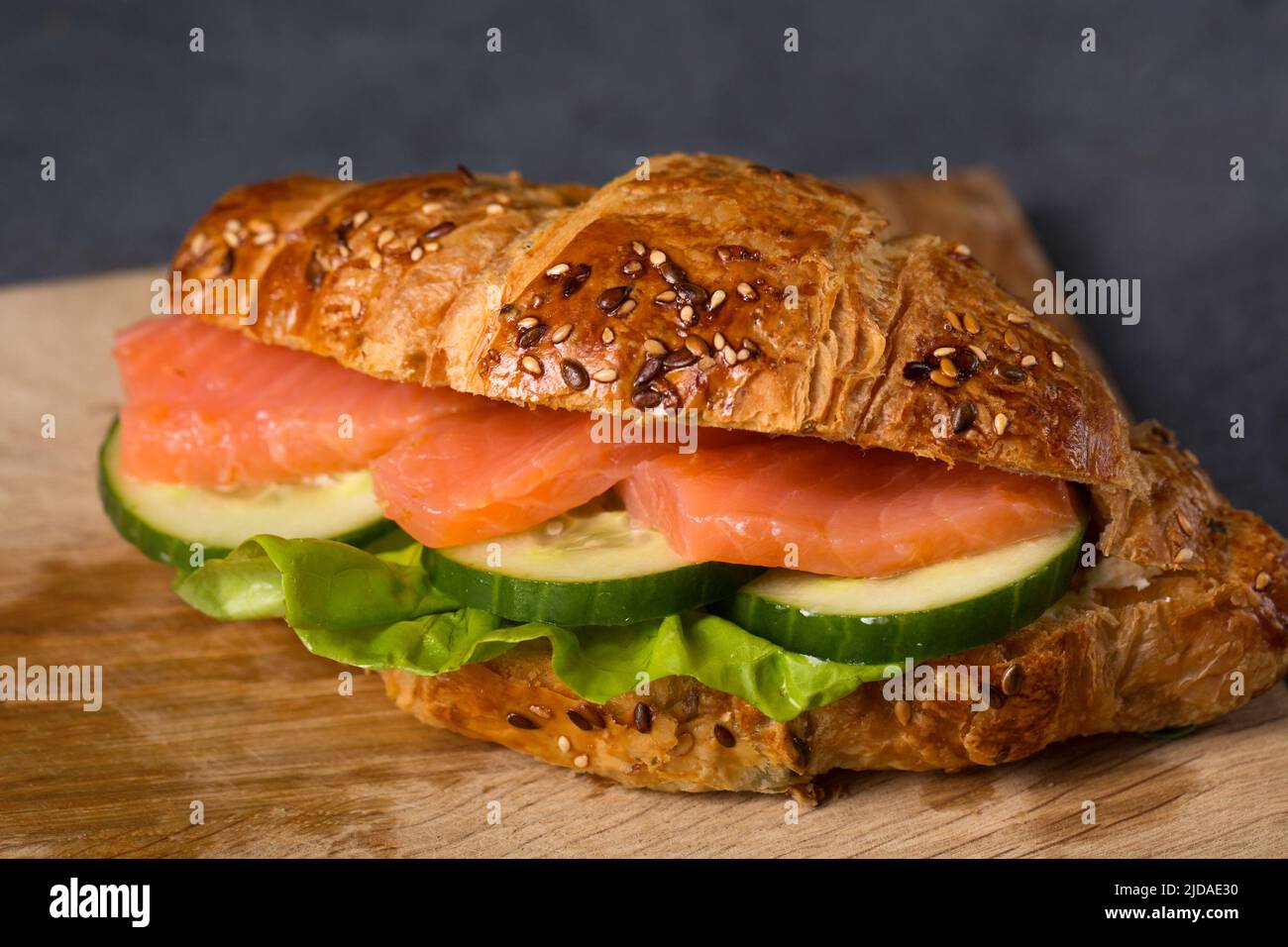 The chef prepares the croissant with the filling Stock Photo - Alamy