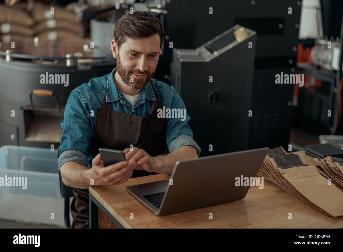 Black man roasting coffee hi-res stock photography and images - Alamy