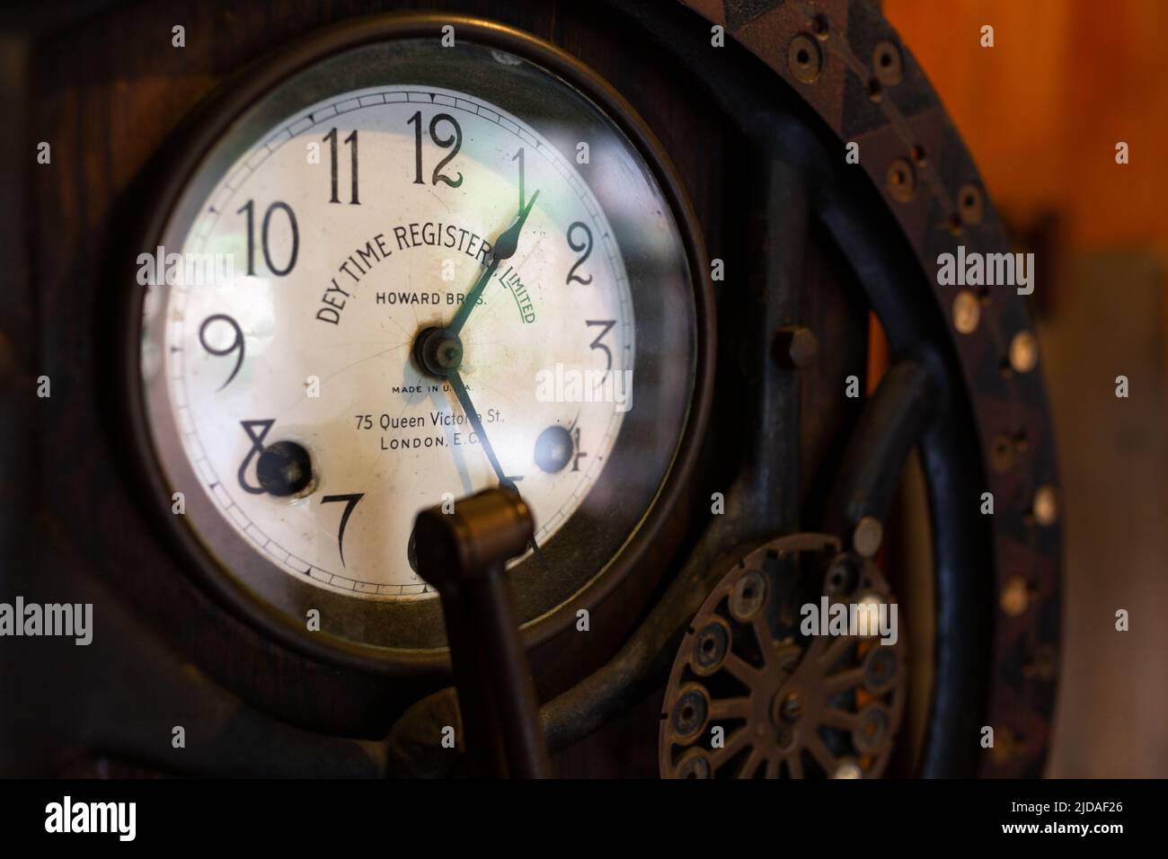 Old fashioned clocking in clock hi-res stock photography and images - Alamy