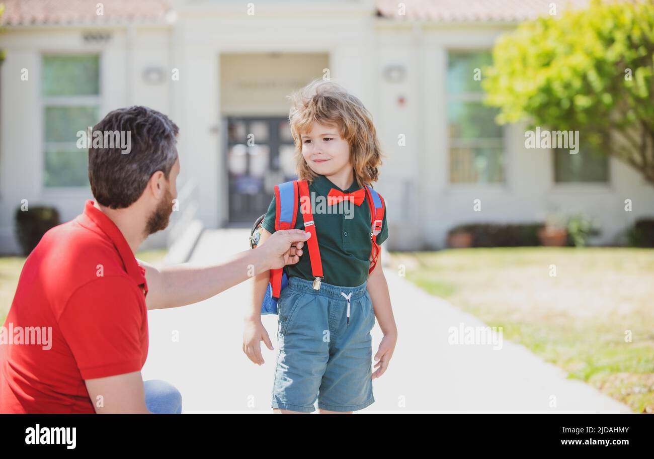 School boy going to school with father Stock Photo - Alamy
