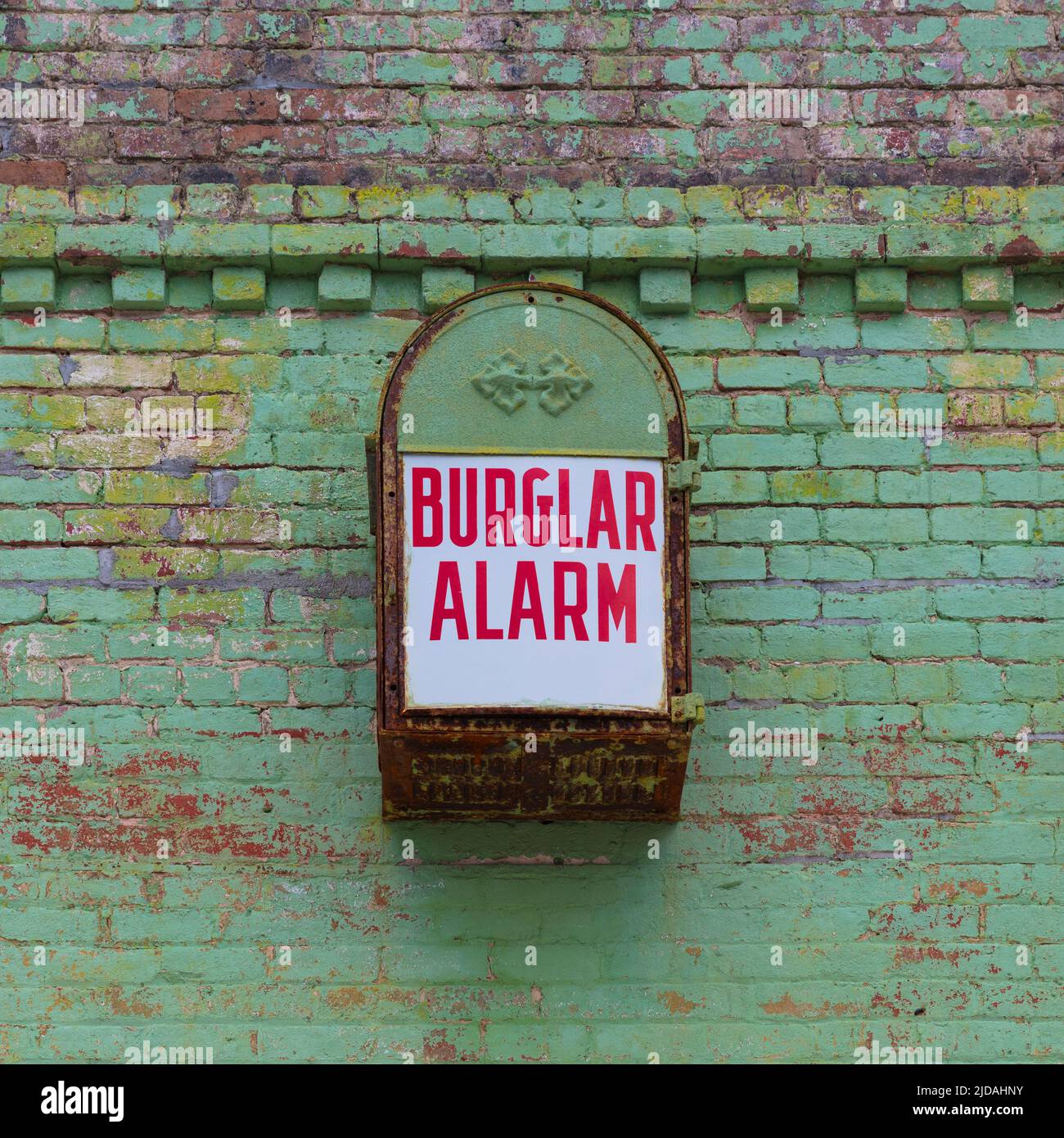 Old burglar alarm ona building facade Stock Photo - Alamy