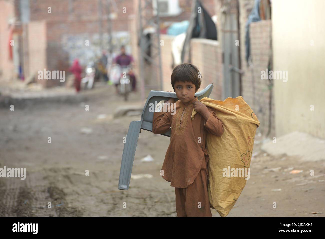 Lahore, Punjab, Pakistan. 19th June, 2022. Afghan refugee family busy in daily routine work ...