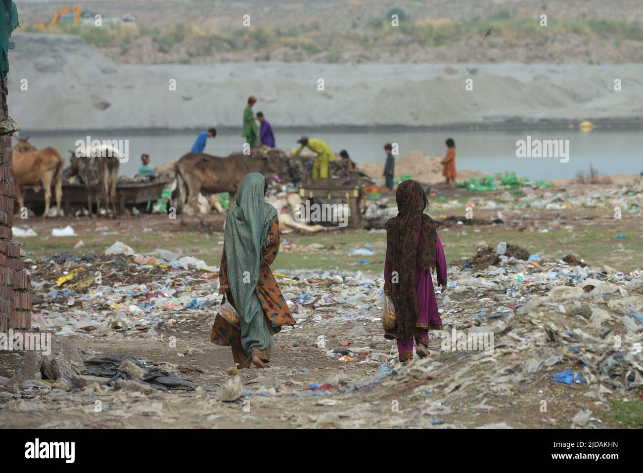 Lahore, Punjab, Pakistan. 19th June, 2022. Afghan refugee family busy in daily routine work ...