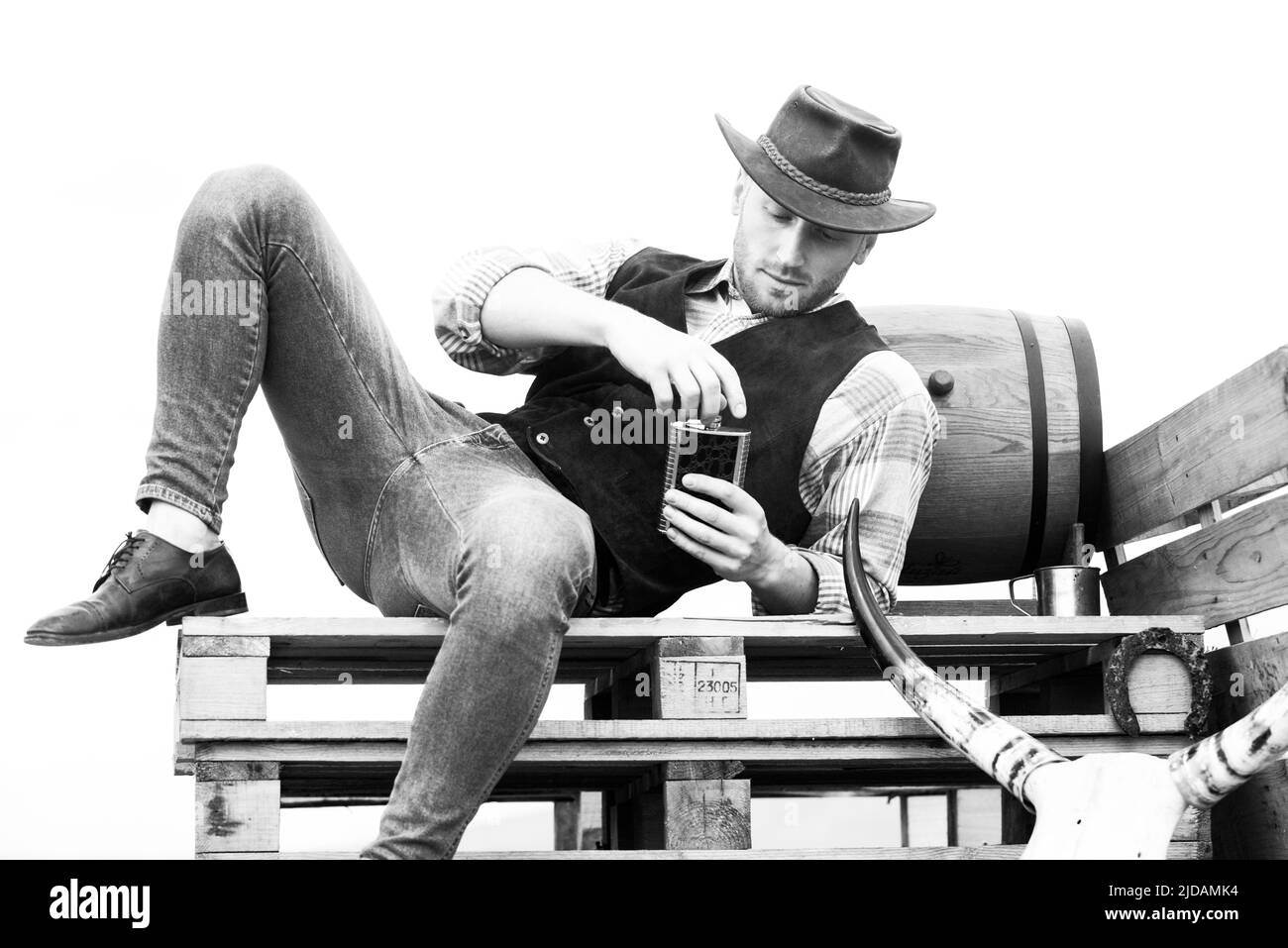 American cowboy man. Brutal western. Guy drinking whiskey Stock Photo ...