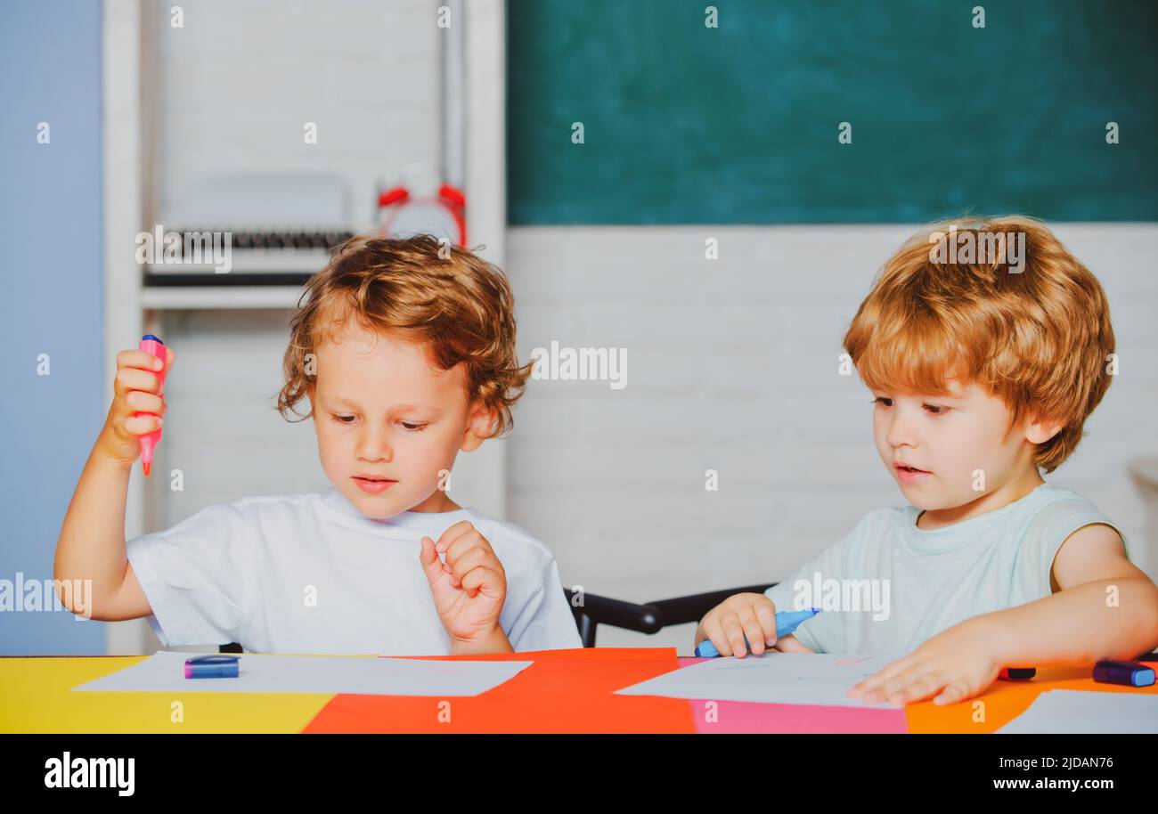 Happy cute clever boys pupils drawing. Kids funny education. Preschool ...