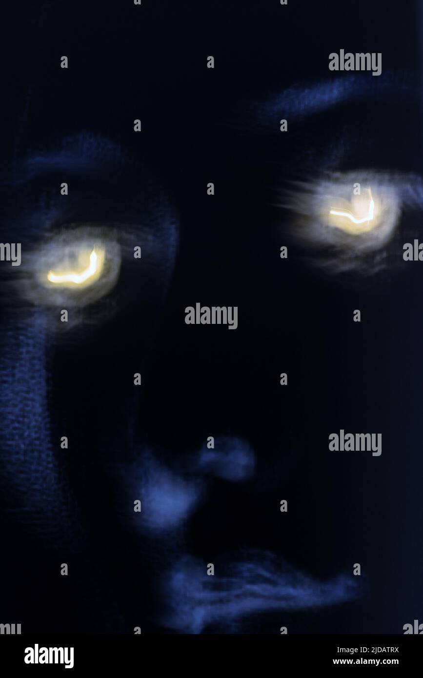 Eerie face of woman with electric glowing eyes Stock Photo - Alamy
