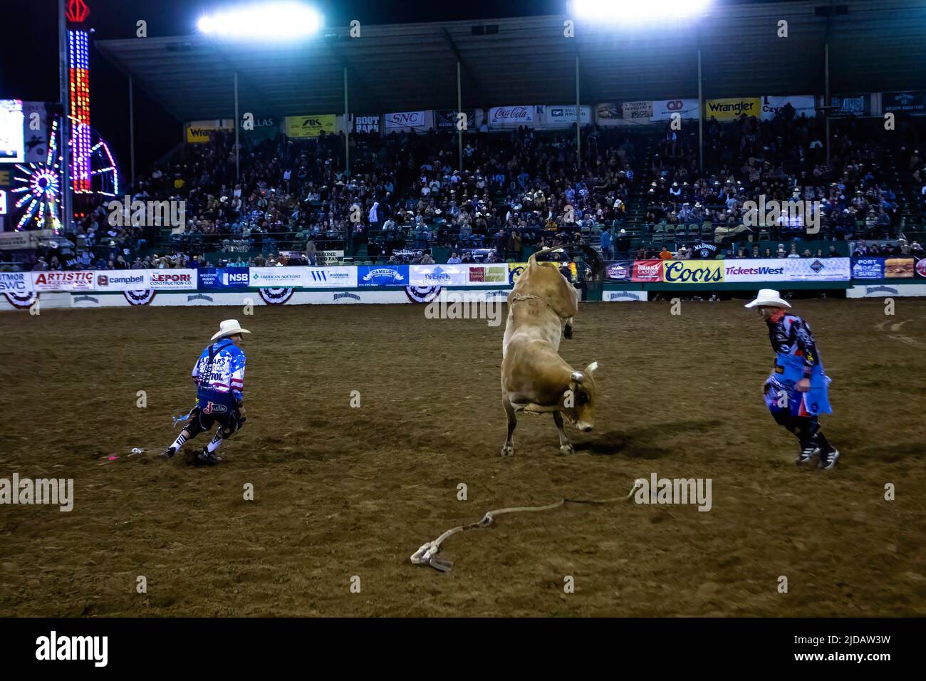 Reno, United States. 18th June, 2022. Bullfighters work to get a bull ...
