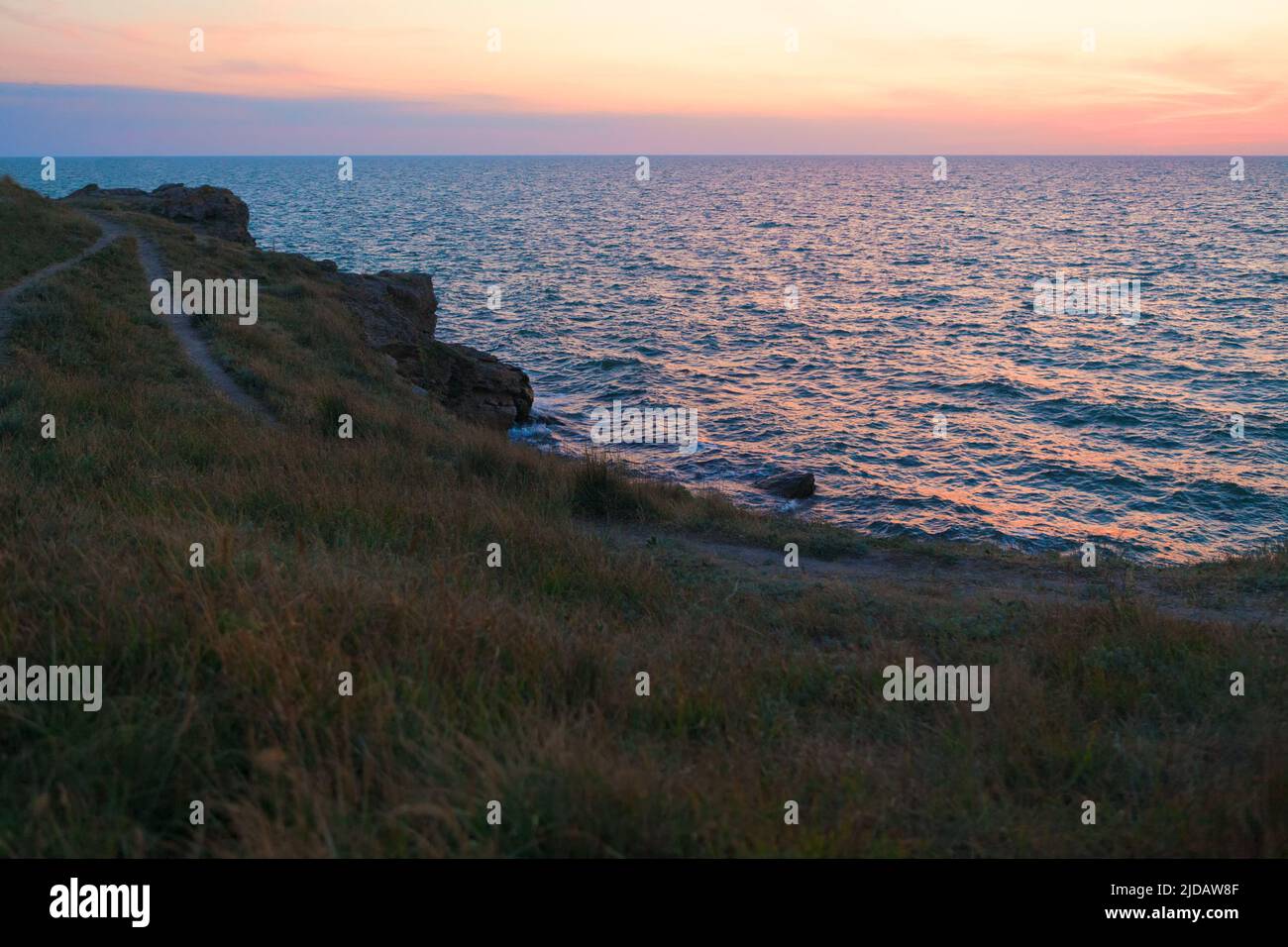 Sea of Azov in the evening . Coastal walking path Stock Photo - Alamy