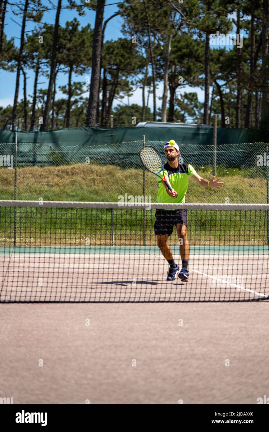 Tennis player performing a drop shot on court Stock Photo - Alamy