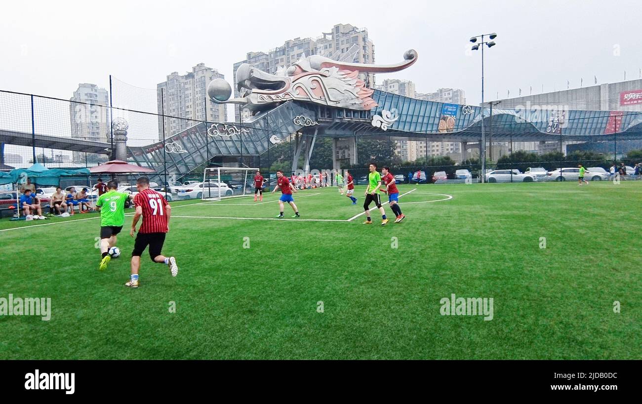 SHANGHAI, CHINA - JUNE 19, 2022 - Fans play football at the "Giant ...