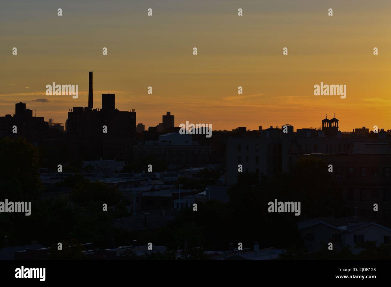 Sunset over a residential building is seen in The Bronx, New York City ...