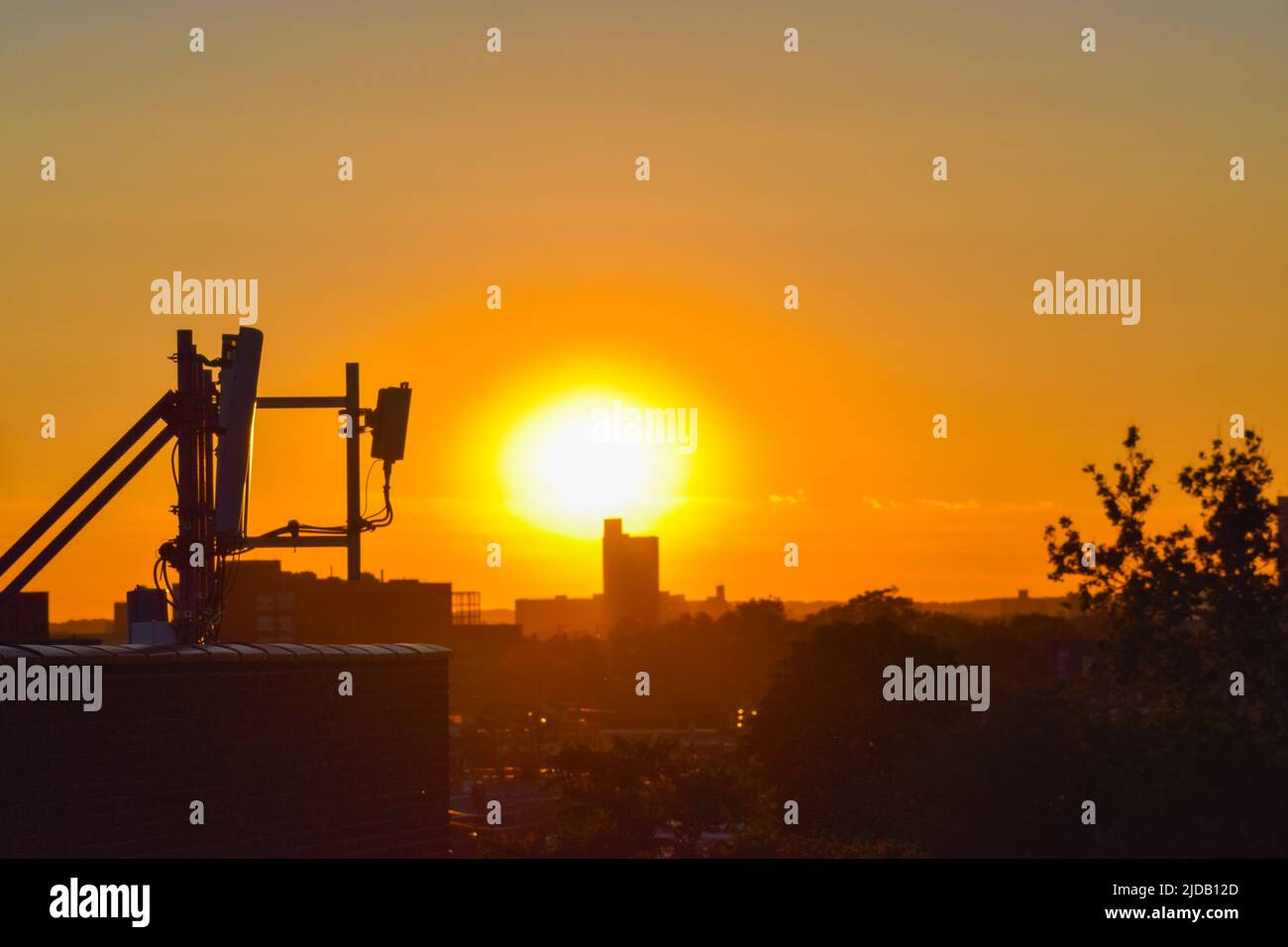 Sunset over a residential building is seen in The Bronx, New York City ...