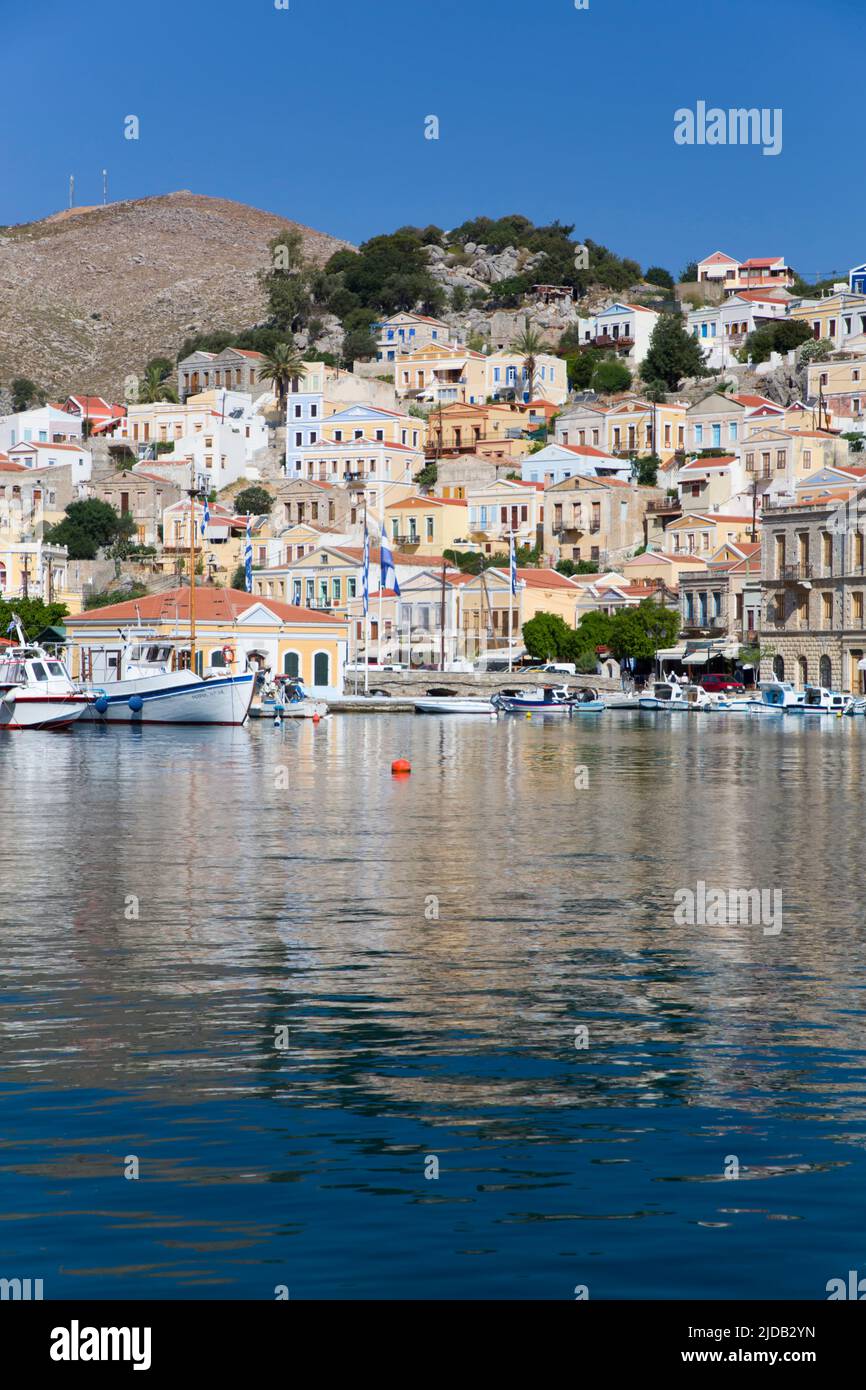Sunny day on the waterfront at Gialos Harbor, Symi (Simi) Island ...