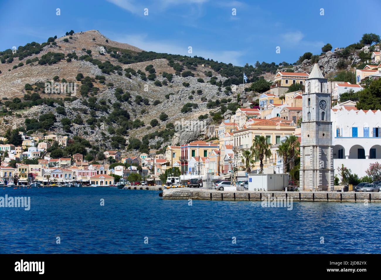 Symi Clock Tower on the waterfront at Gialos Harbor, Symi (Simi) Island ...