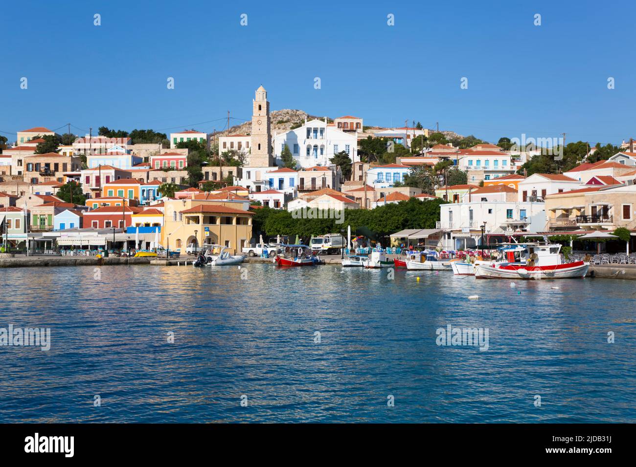 Traditional buildings and boats moored along the waterfront in the ...