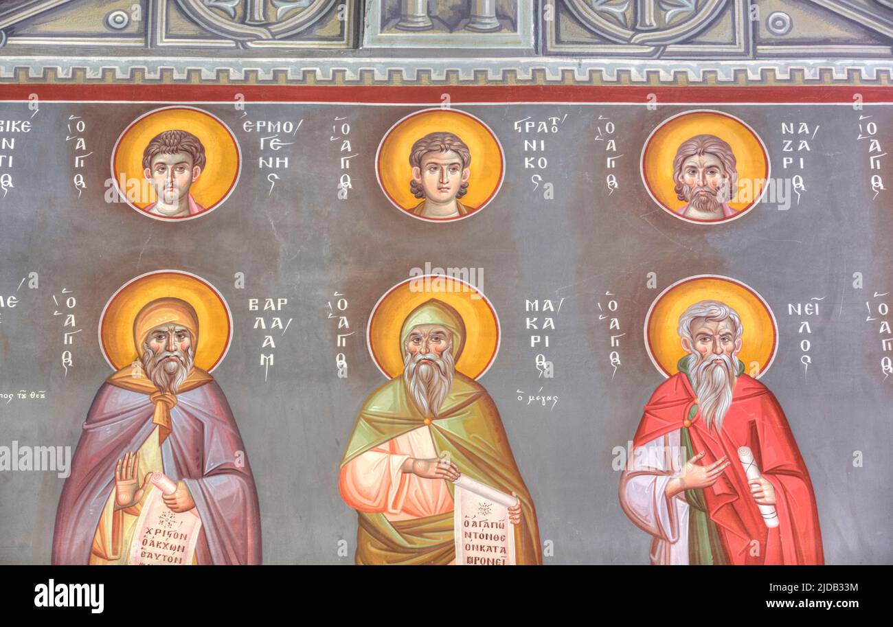 Close-up of colorful religious fresco of three saints inside the Holy ...