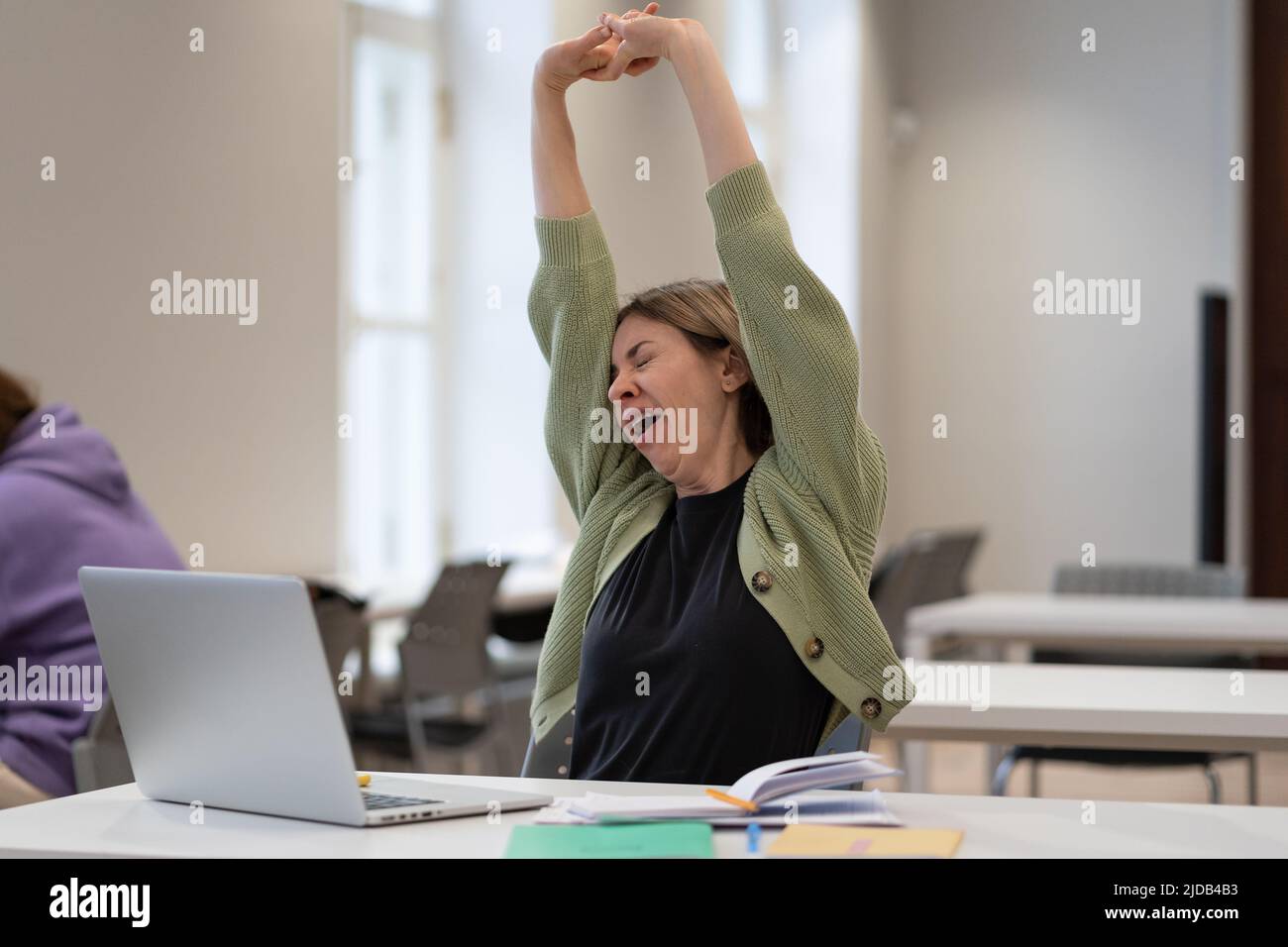 Woman taking study break desk hi-res stock photography and images - Alamy