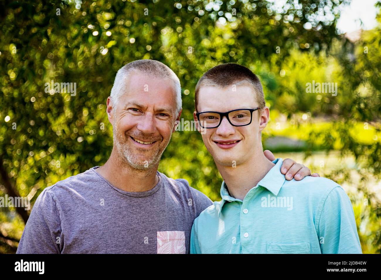 Outdoor portrait of a father with his young adult son; Edmonton ...