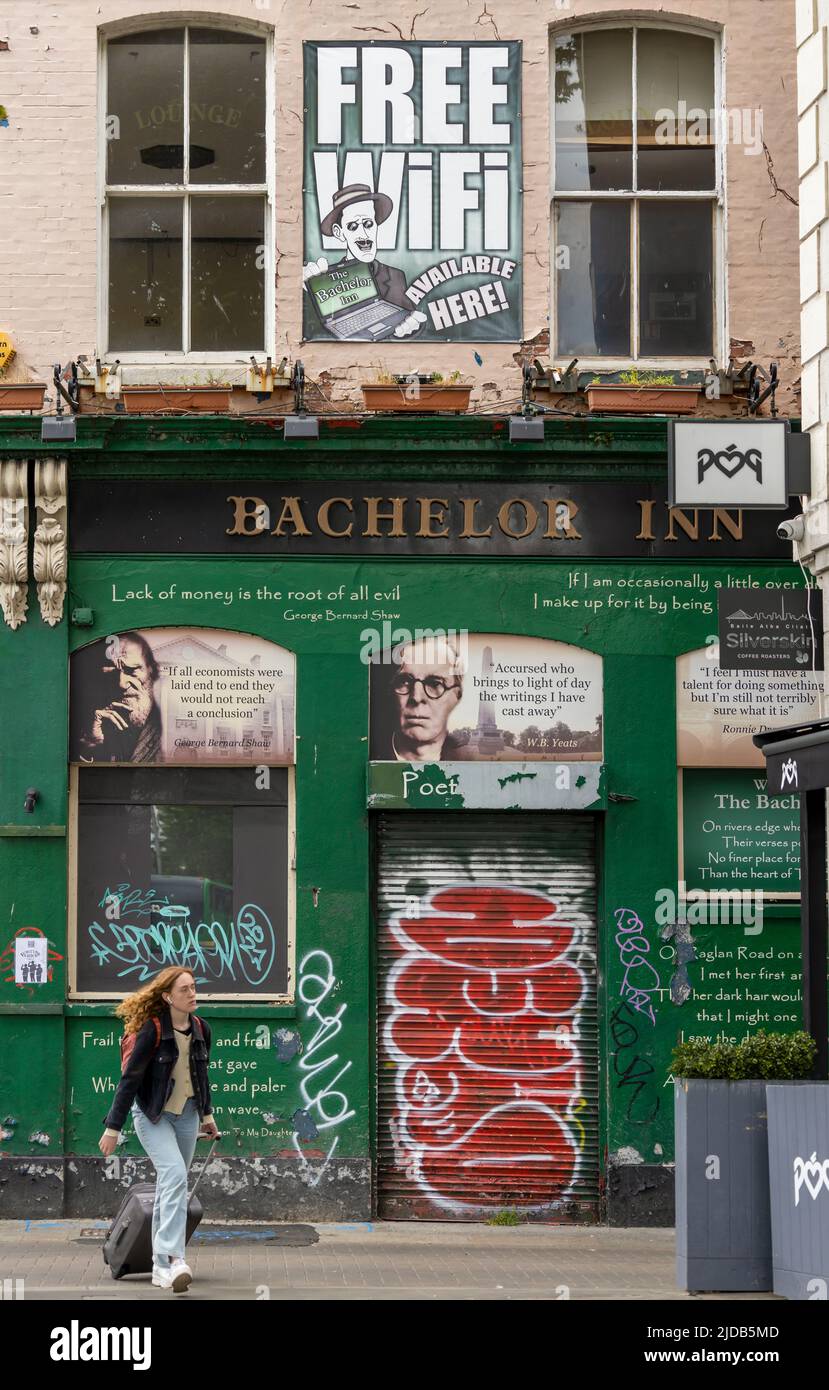 Dublin, Ireland - June 2, 2022: A girl walking on Bachelors Way street ...