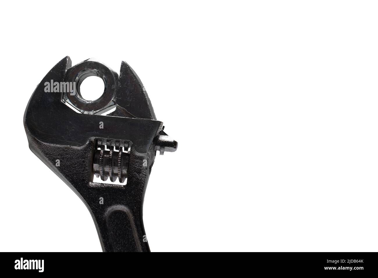 Close up of adjustable solid open end wrench adapted to inserted nut ...