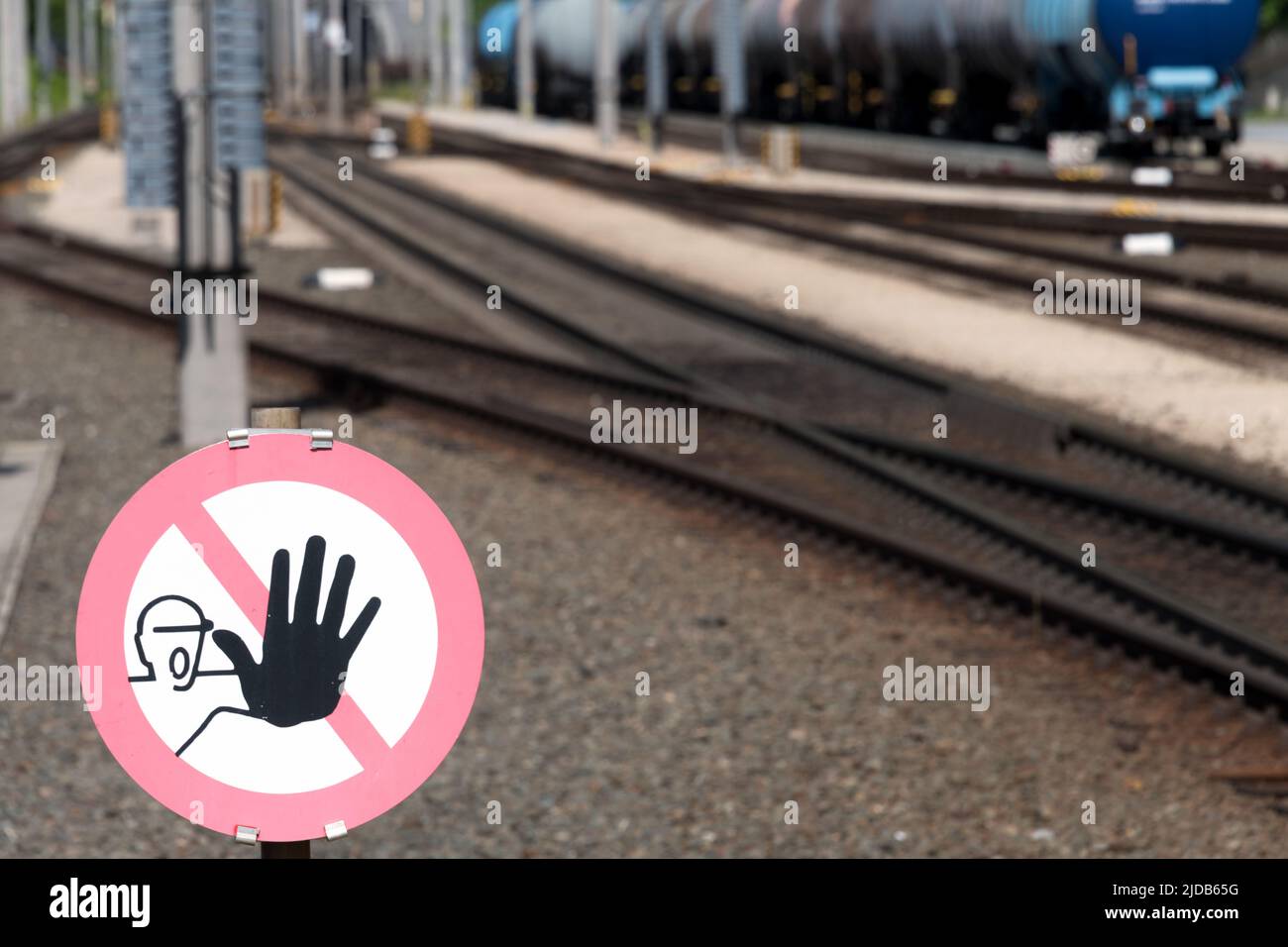 clearly visible danger sign stop danger with railroad tracks rails and ...