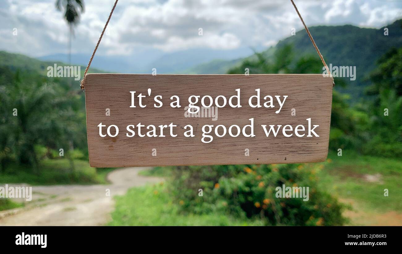 Inspirational quote text on wooden banner - It is a good day to start a ...