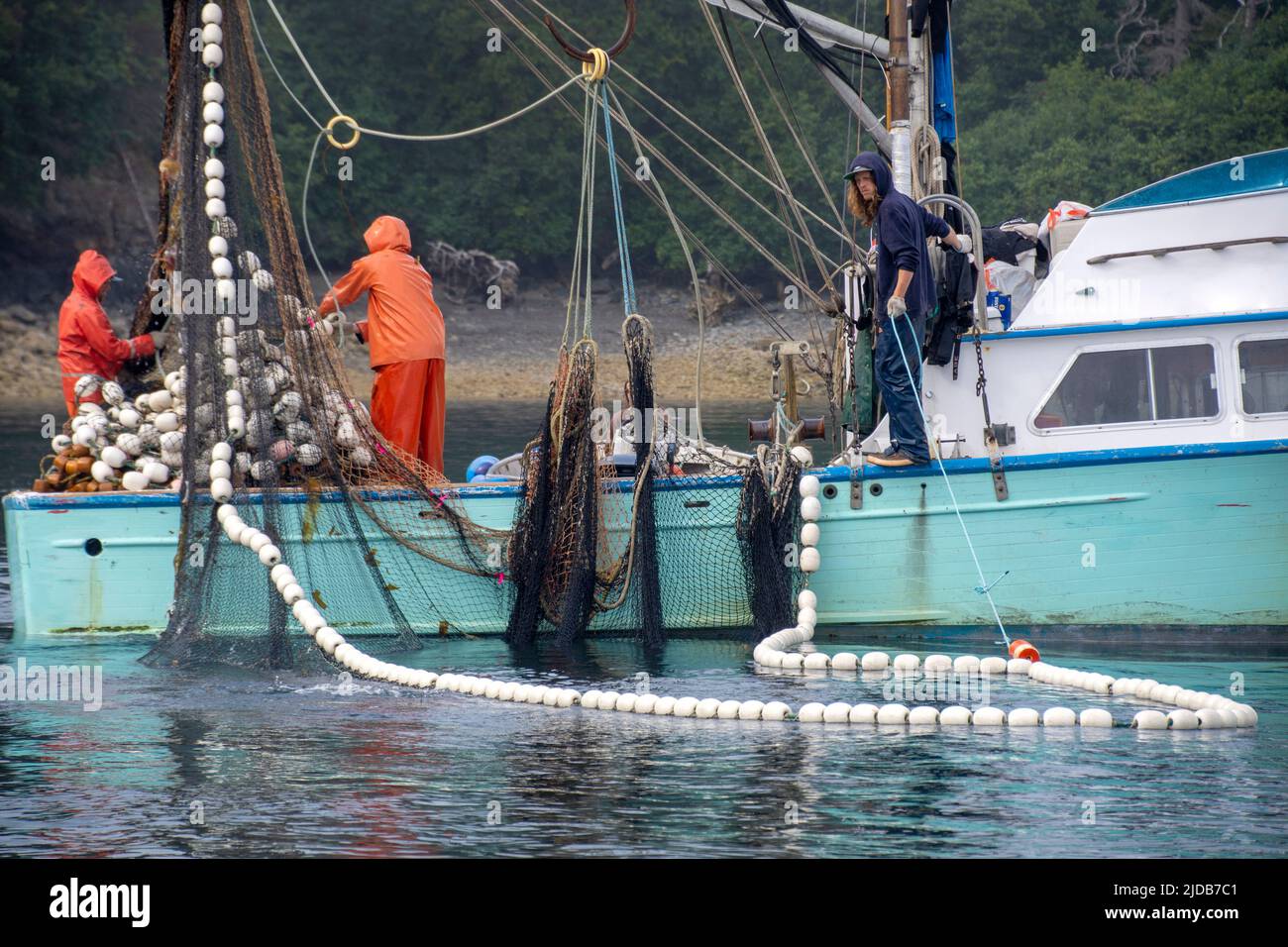 Salmon purse seiner and crew work the waters of Kachemak Bay for ...