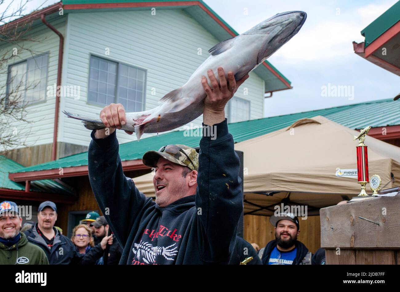 Competitor holds his 2nd place fish during the weigh-in and awards ...