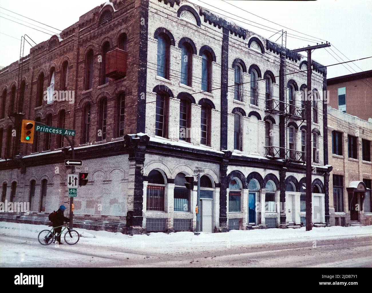 Cyclist and Bathgate Block (242 Princess Street) in Winnipeg, circa ...
