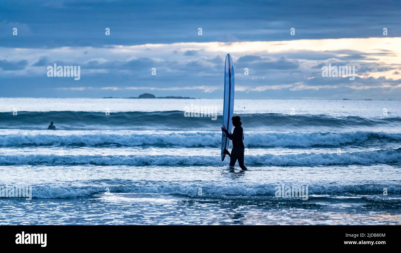 Surfers in the surf at the popular surfing destination on Chesterman ...