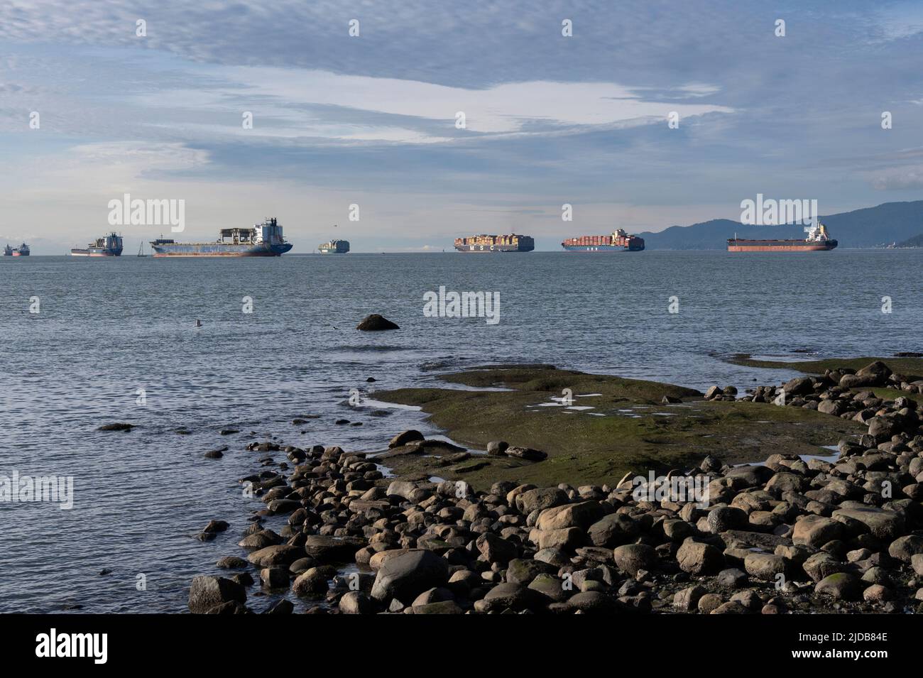 Cargo ships moored off the coast of Vancouver, BC; Vancouver, British ...