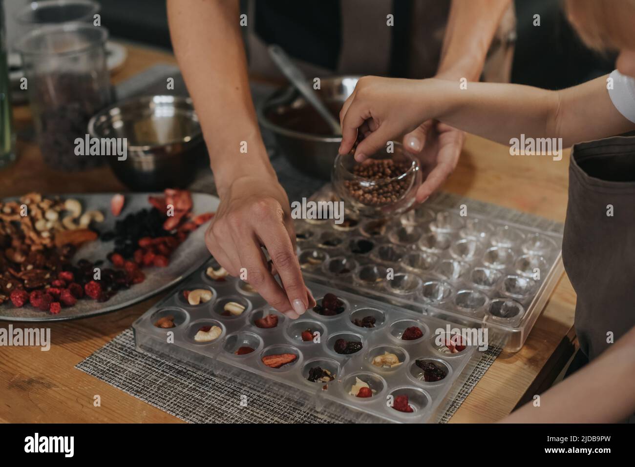 Mom and daughter make chocolate at home Stock Photo - Alamy