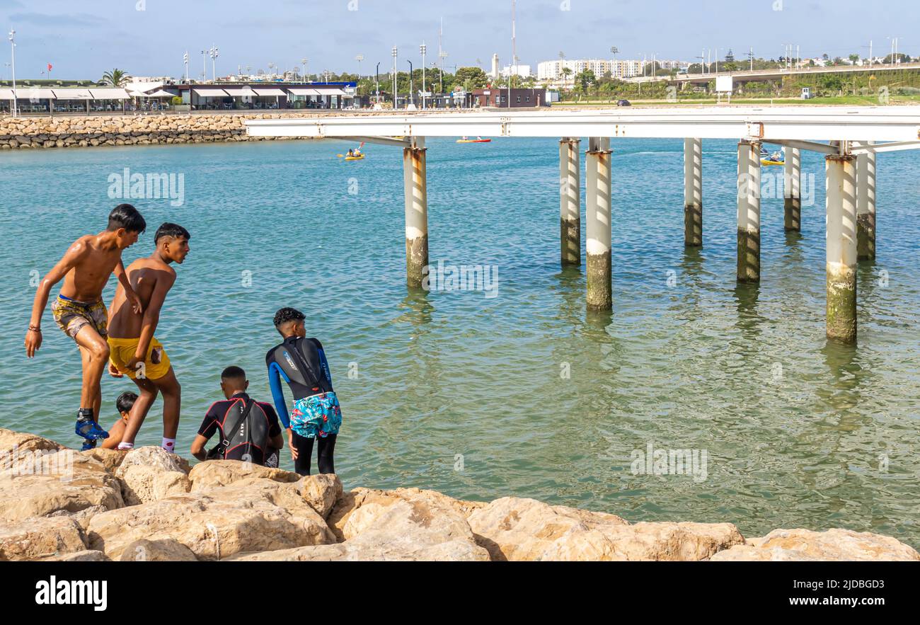 Kids swimming at the bay pier in central Rabat, Morocco Stock Photo - Alamy