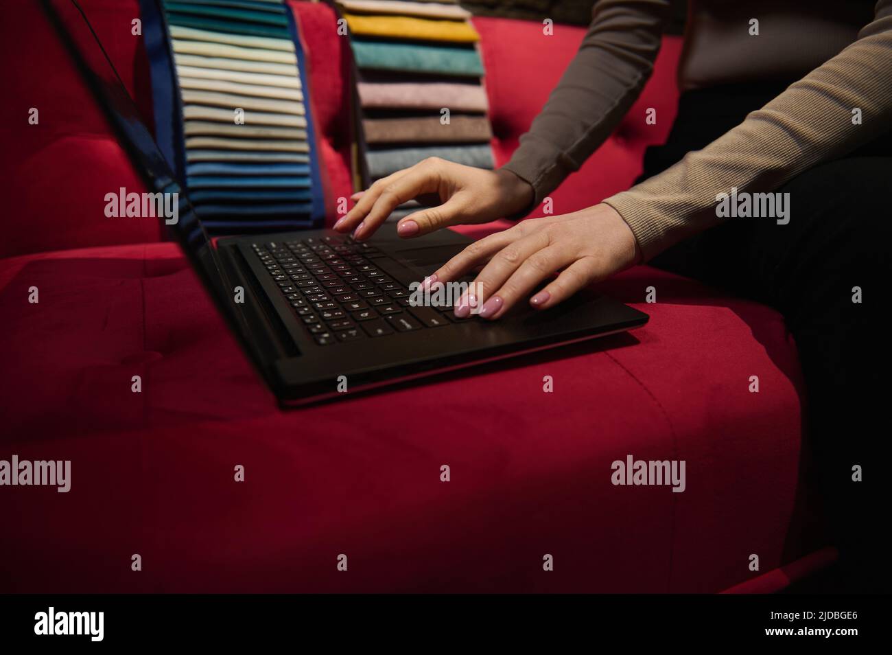 Details: Hands of unrecognizable woman typing text on laptop keyboard ...