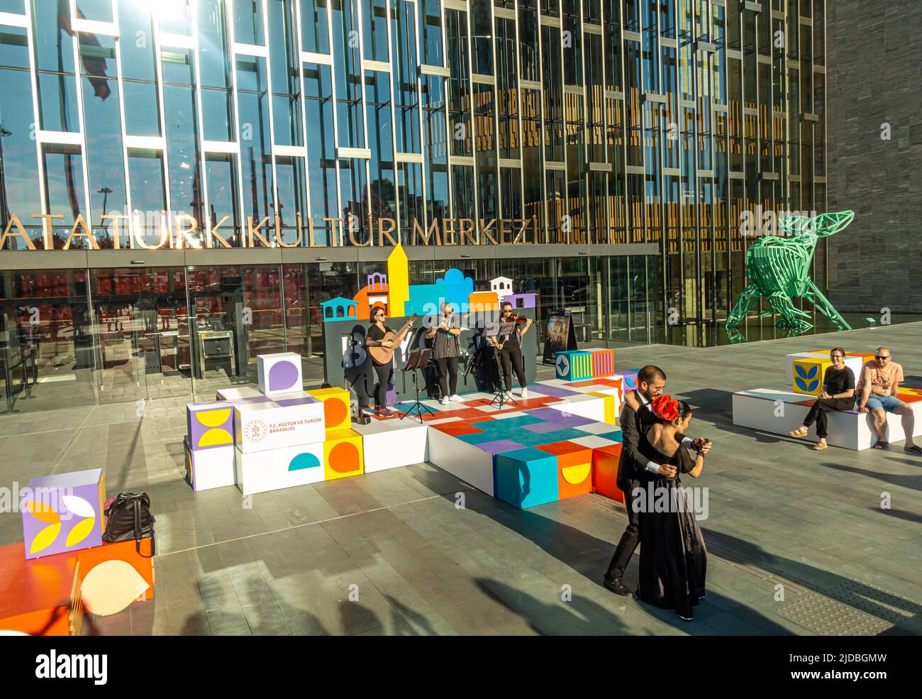 Band performing and couple dancing tango in front of Ataturk Cultural ...