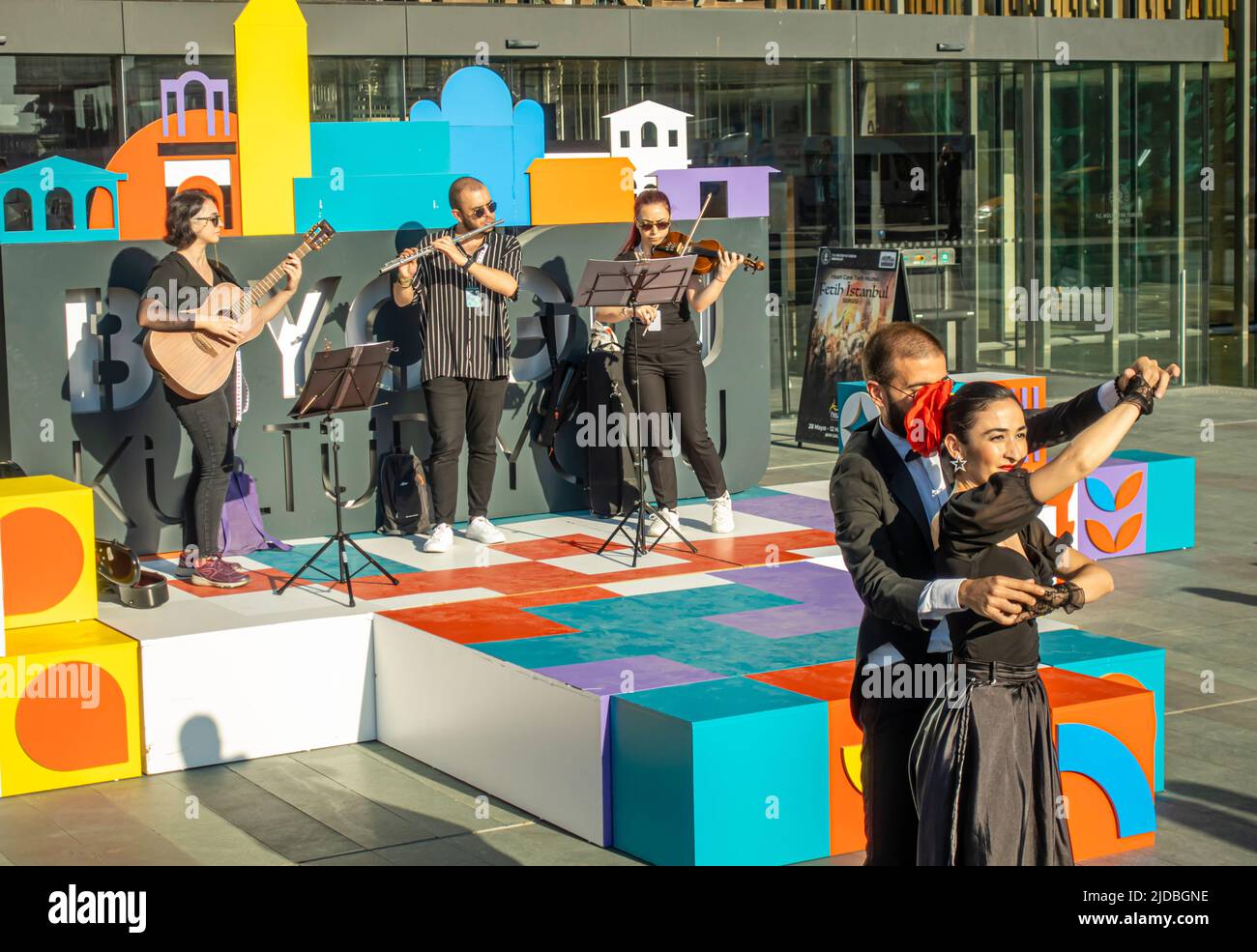 Band performing and couple dancing tango in front of Ataturk Cultural ...