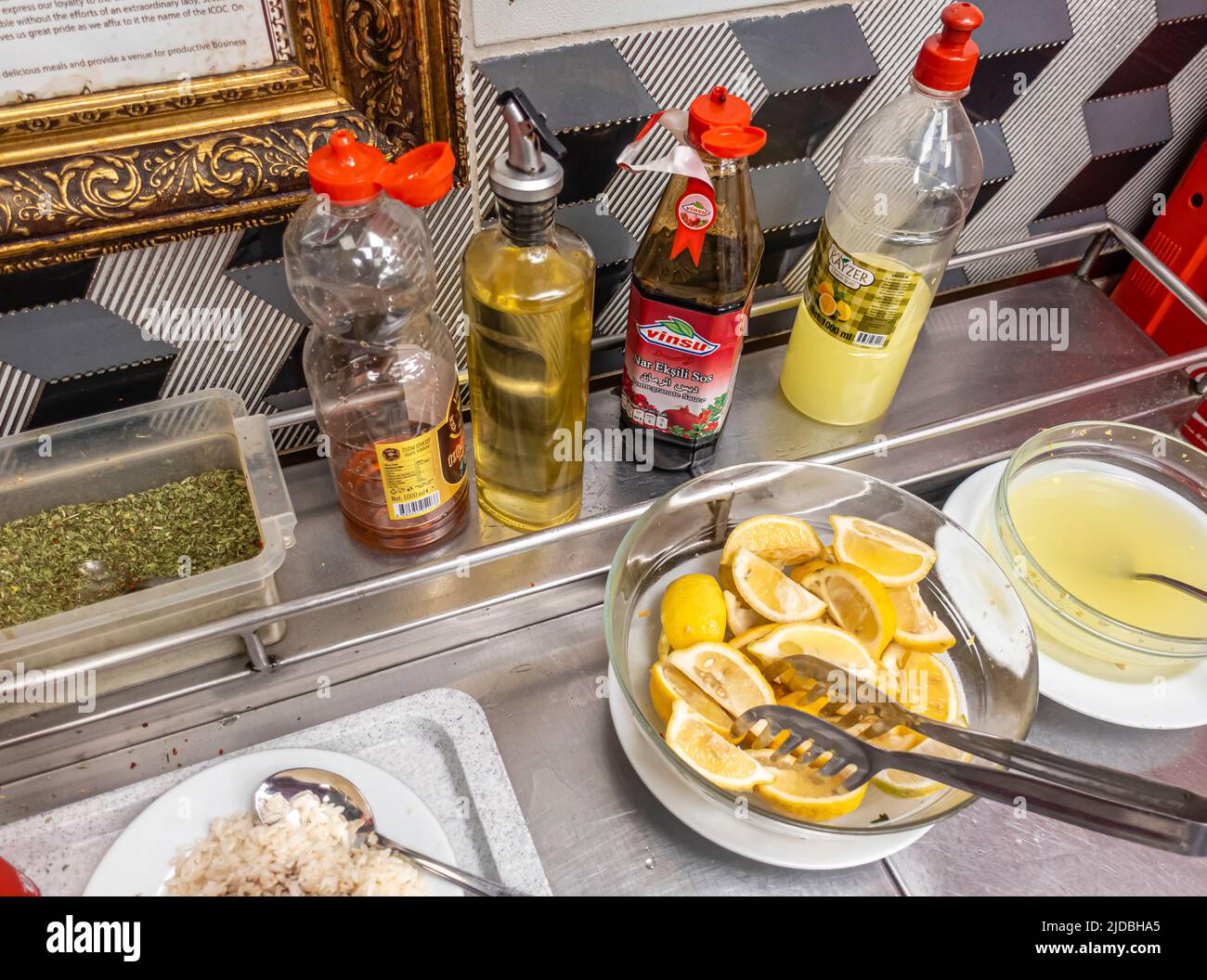 Condiments, oil, bottles, lemon in typical Turkish eaterie, Istanbul ...