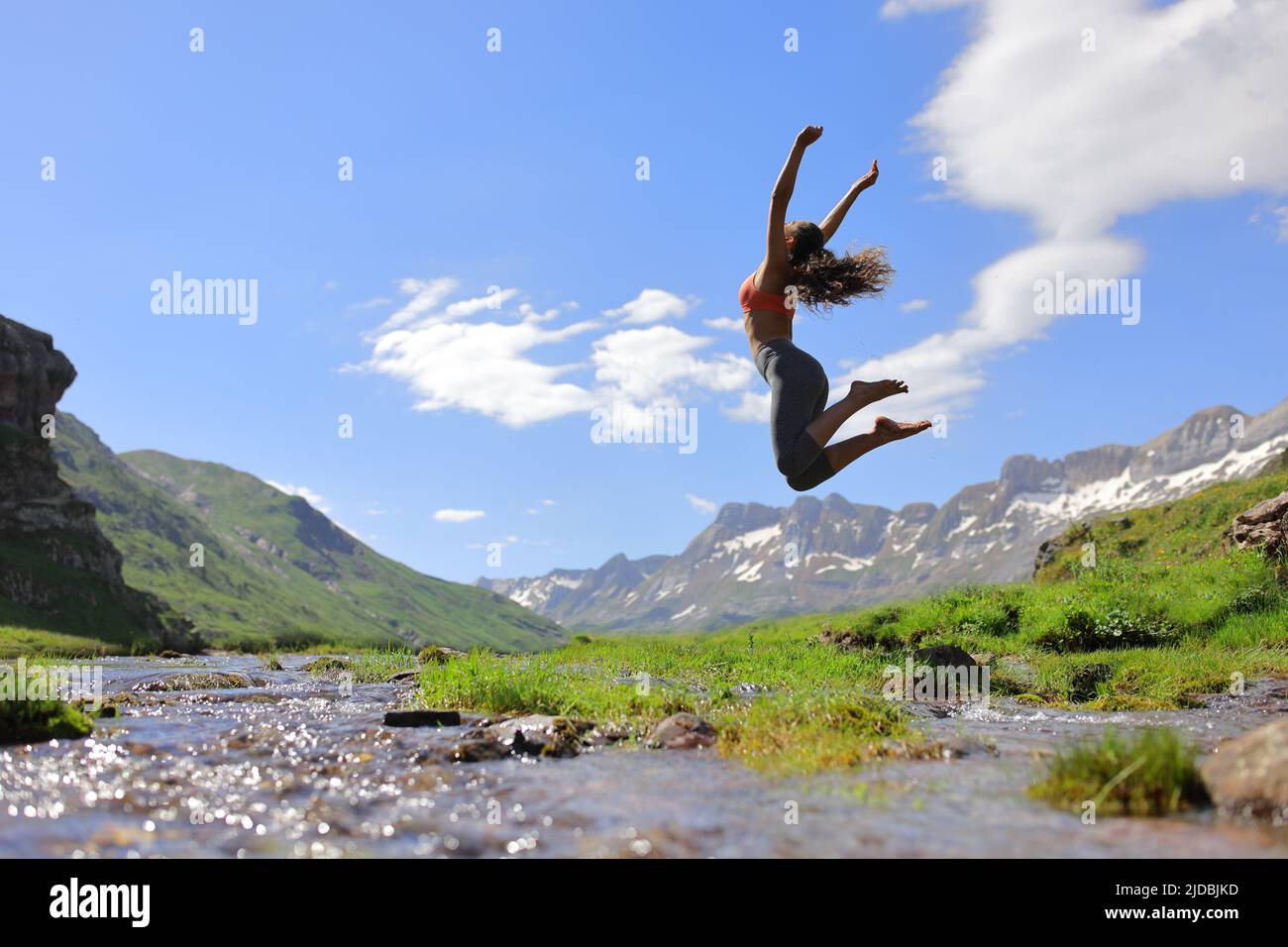 Girl jumping in river hi-res stock photography and images - Alamy