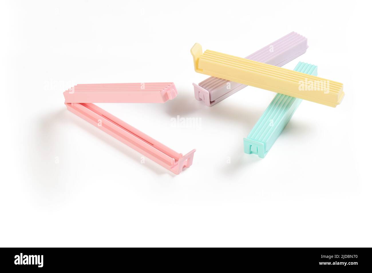 Plastic bag clips on a white background, photo stacking Stock Photo - Alamy