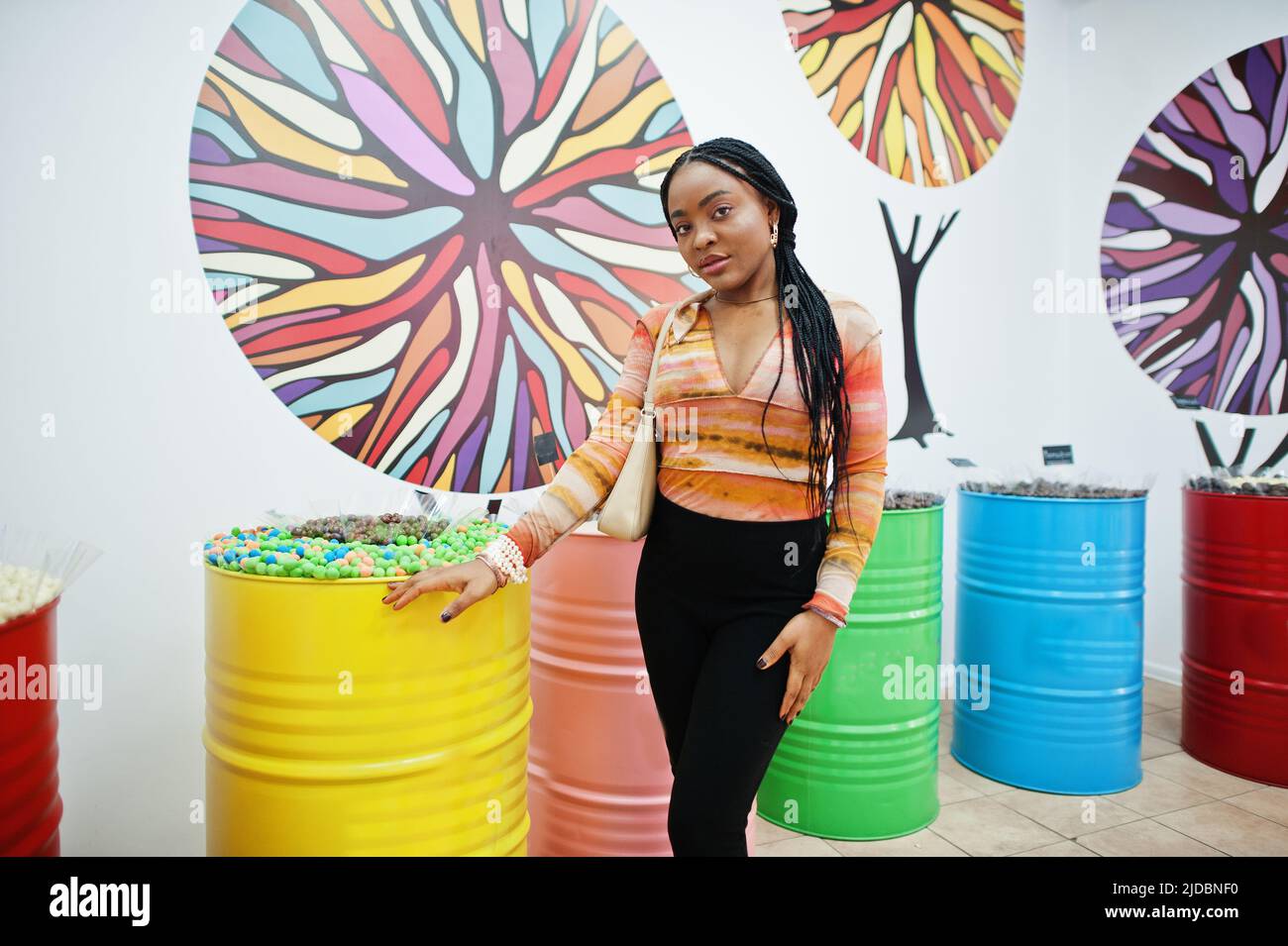 African american millennial lady at candy shop Stock Photo - Alamy