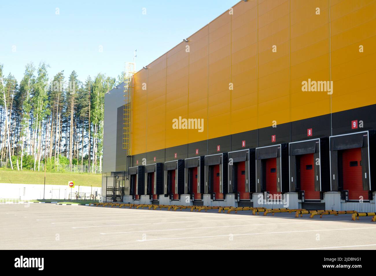 Large distribution warehouse with gates for loading goods. Storage ...