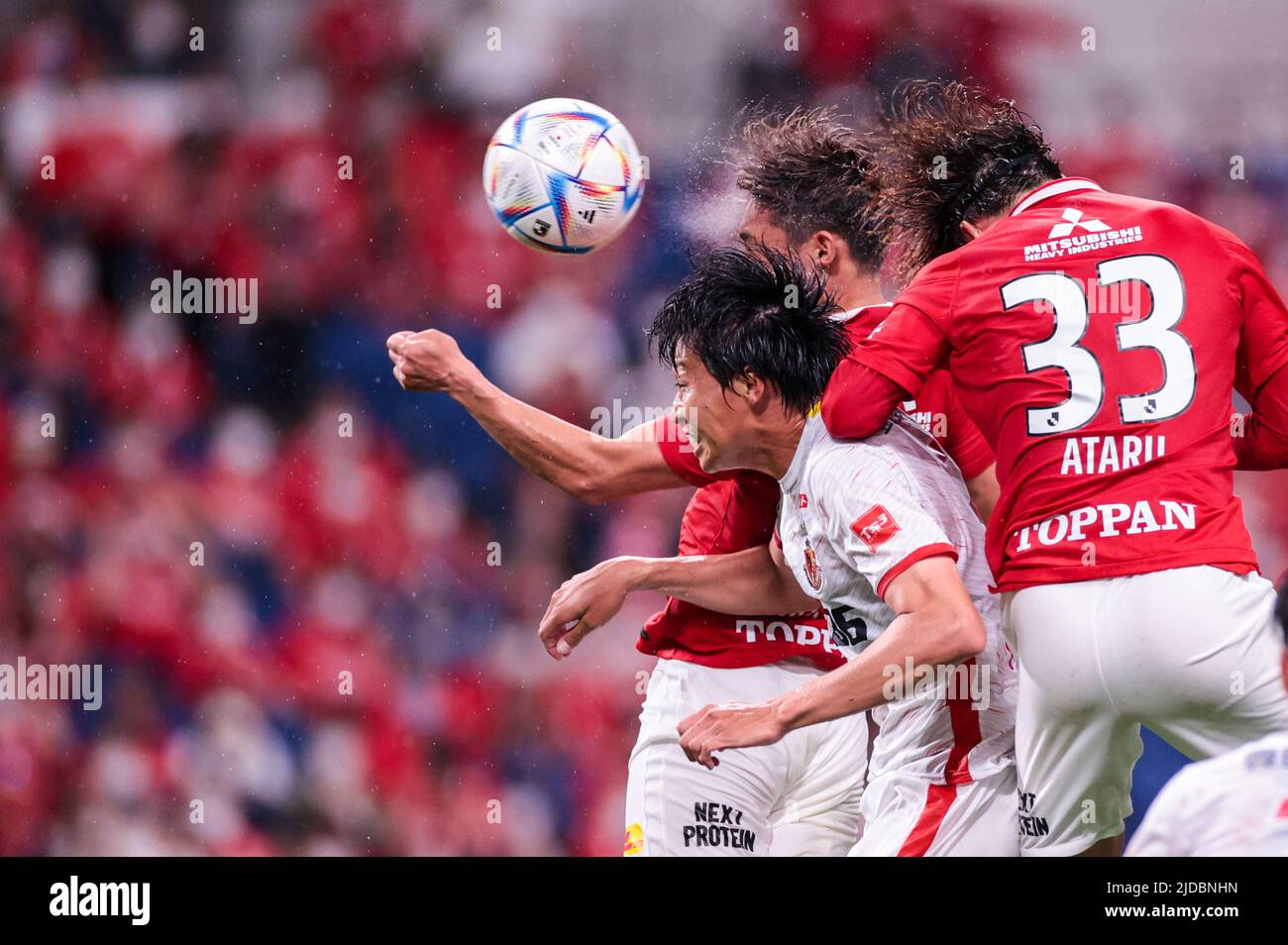 Saitama, Japan. 18th June, 2022. (L-R) Yuichi Maruyama (Grampus), Ataru Esaka (Reds) Football ...