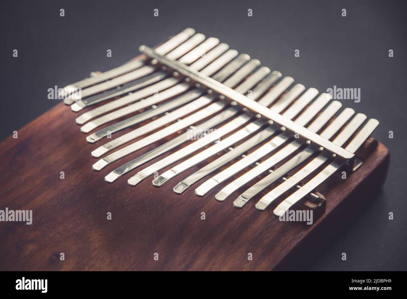 Traditional wooden kalimba isolated on black background Stock Photo - Alamy