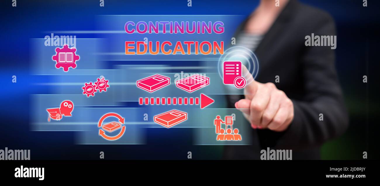 Woman touching a continuing education concept on a touch screen with ...