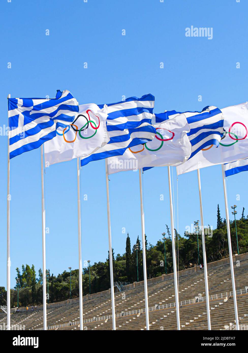 Greek and Olympic flags flying at the Panathenaic Stadium, Athens ...