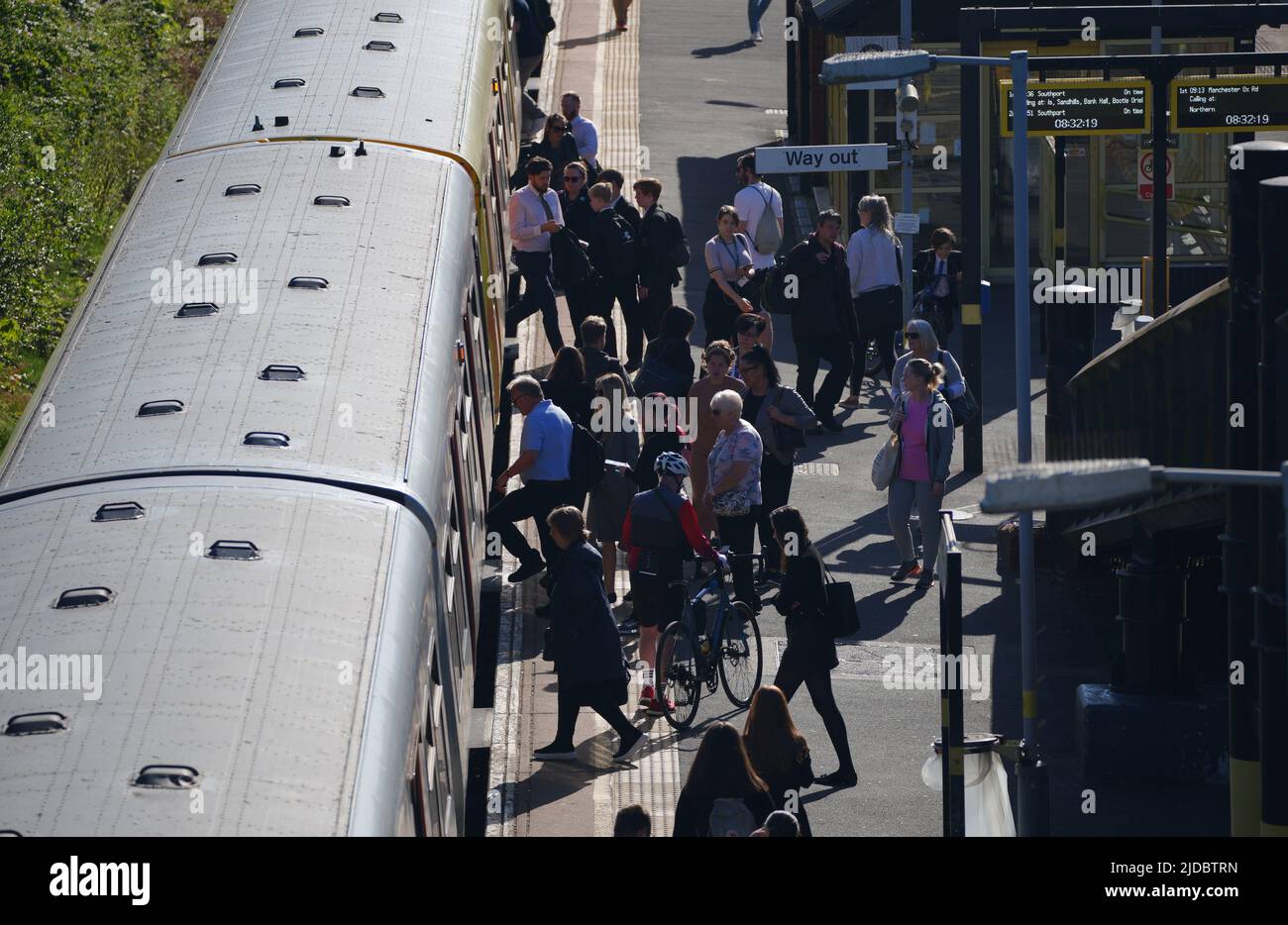 Passengers board a train at Hunts Cross Station, Liverpool. MerseyRail ...
