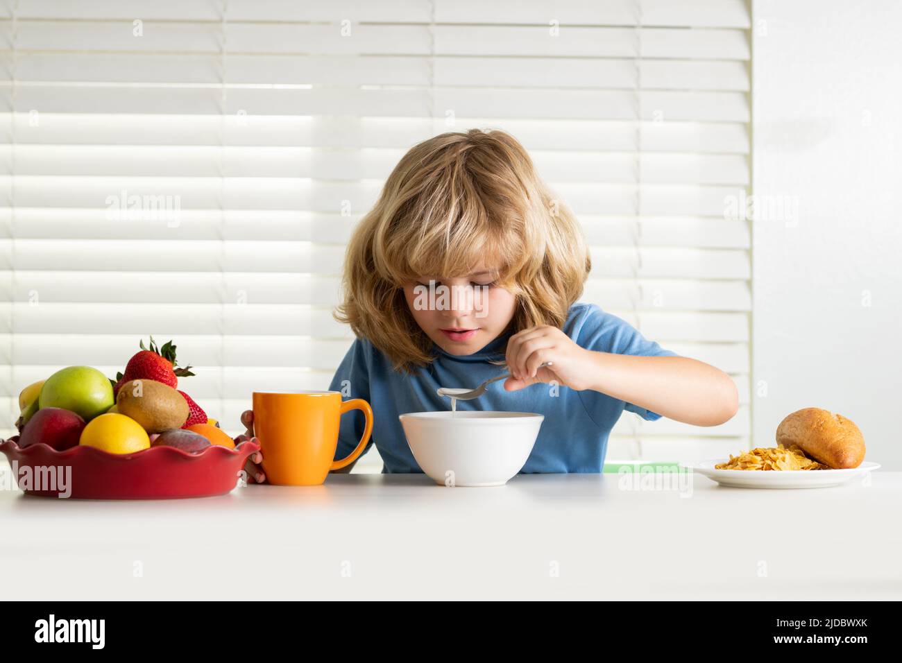 Child boy eating organic healthy food. Healthy vegetables with vitamins ...