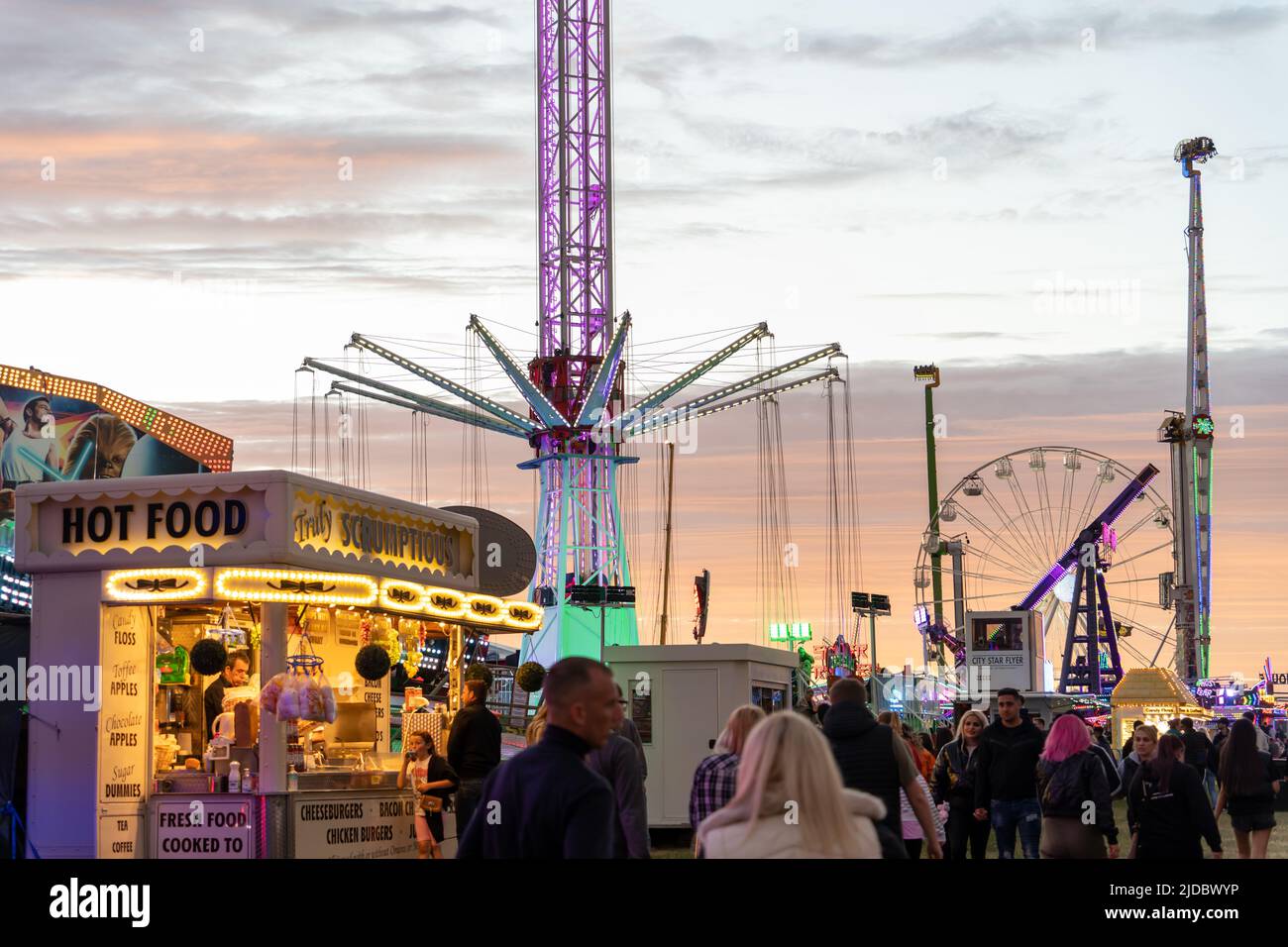 People spending leisure time at the funfair. The 140th 'Hoppings' on ...