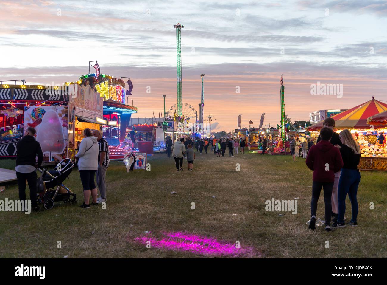 People spending leisure time at the funfair. The 140th 'Hoppings' on ...