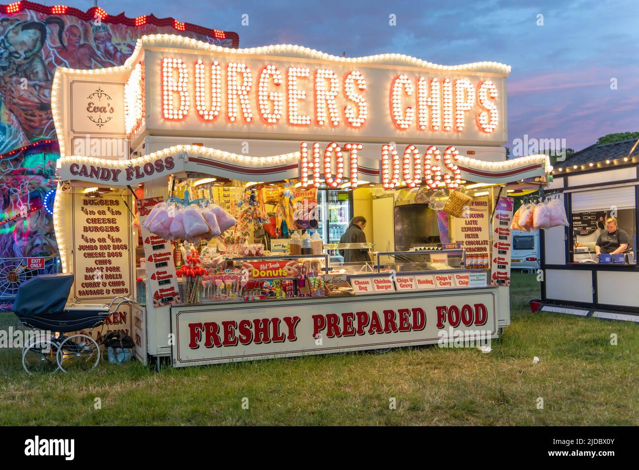Food van selling burgers and chips at the funfair. The 140th 'Hoppings ...